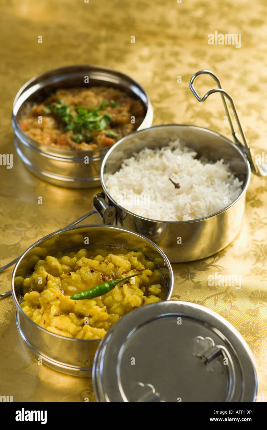 Close-up of tiffin boxes of rice and curry Stock Photo - Alamy