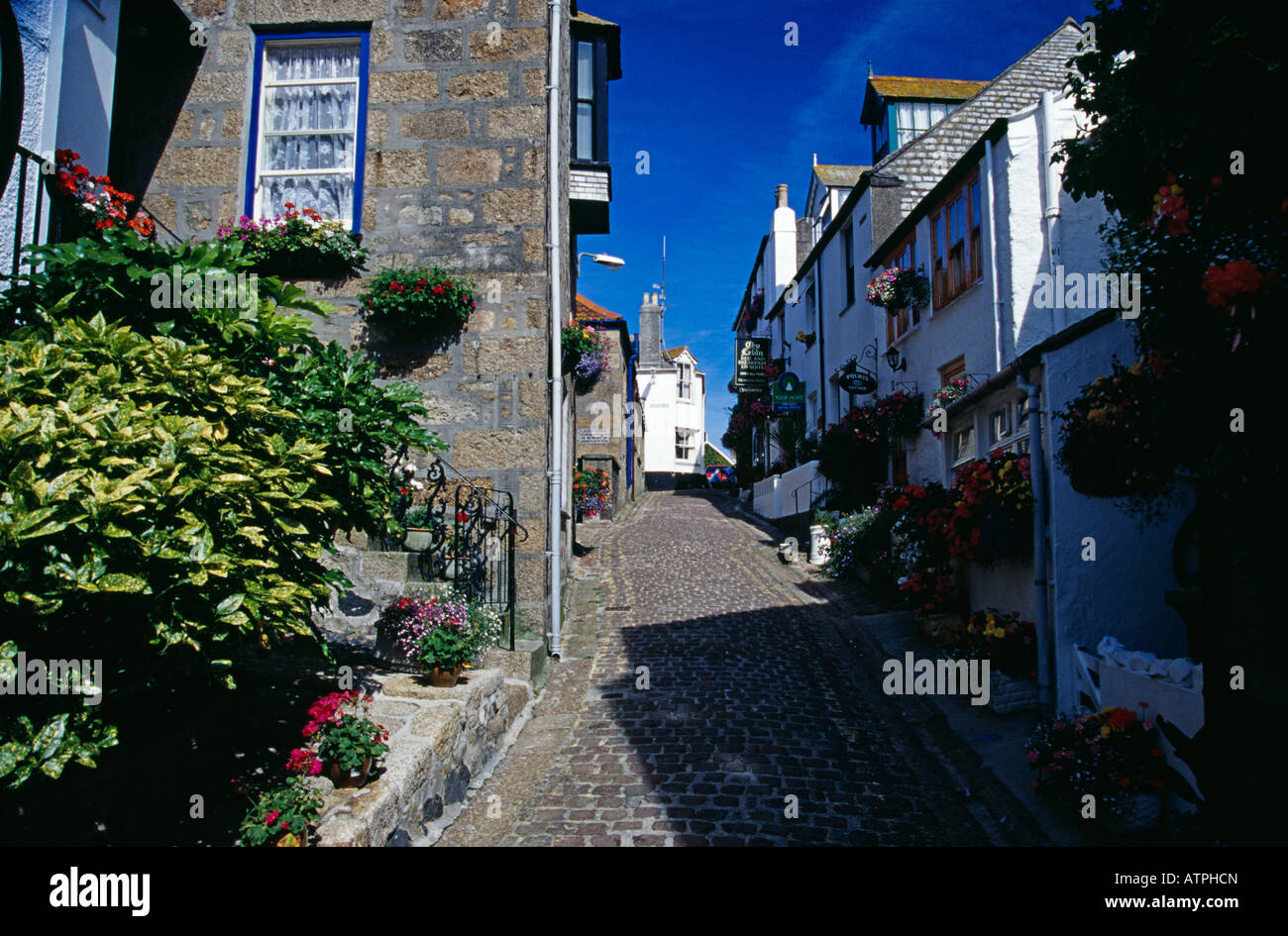 A typical pretty cobbled street scene in St Ives Cornwall England Stock ...