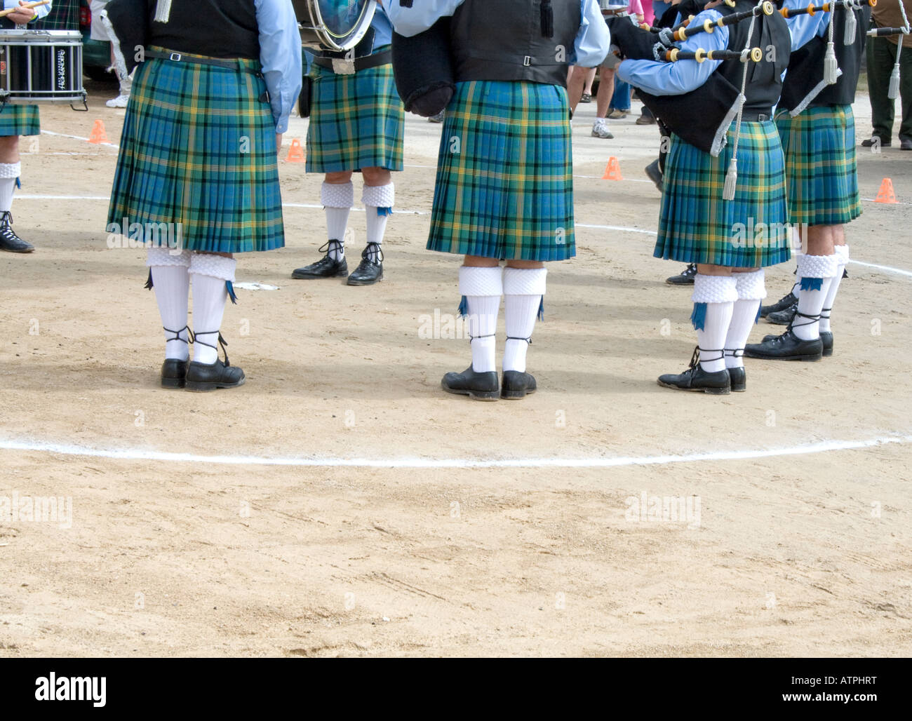 View of a bagpipe band in a circle with their bagpipes Stock Photo - Alamy