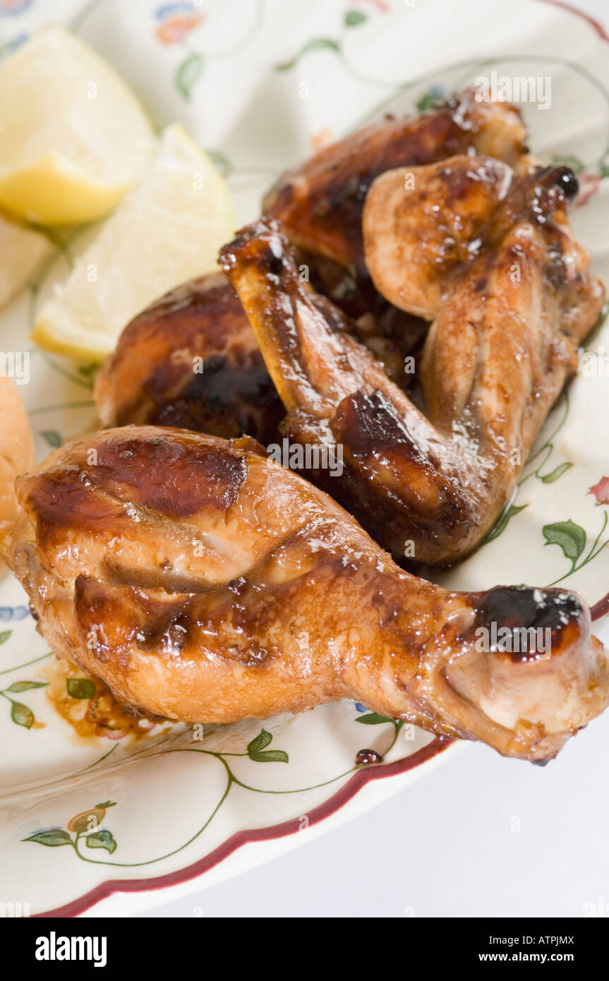 Close-up of roasted chicken in a plate Stock Photo - Alamy
