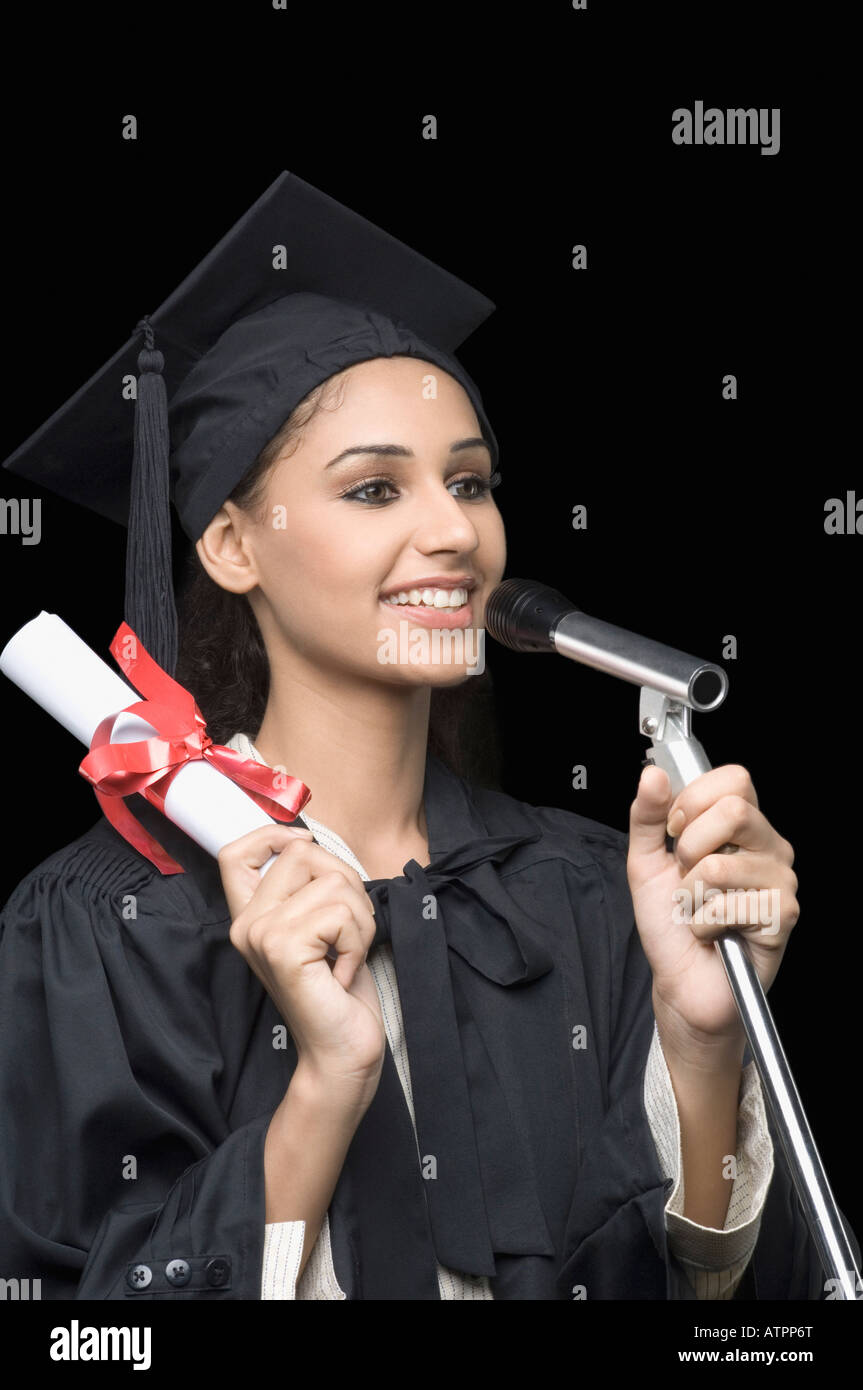 Microphone communication standing smiling graduation gown hi-res stock ...