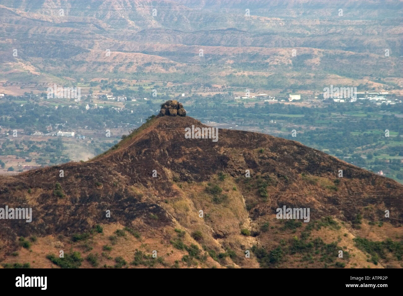 A rock formation on a hillock seen from Sinhagad fort in Pune ...