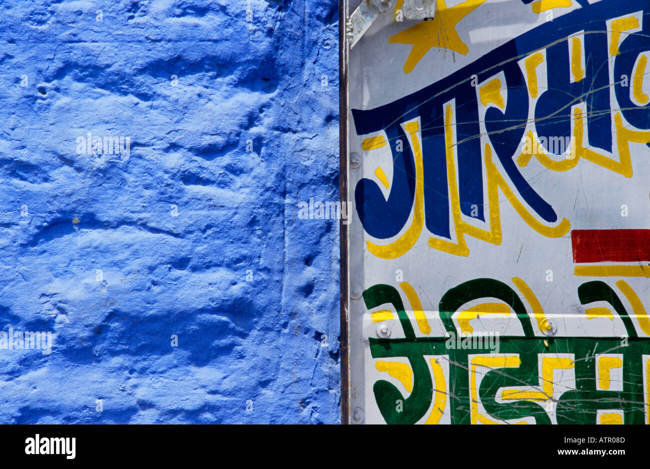 blue wall with indian sign in the city of jodhpur Stock Photo - Alamy