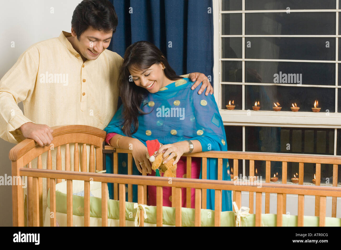 Two women crib man hi-res stock photography and images - Alamy
