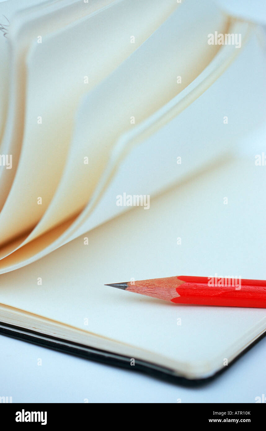 Pencil and notepad Stock Photo - Alamy