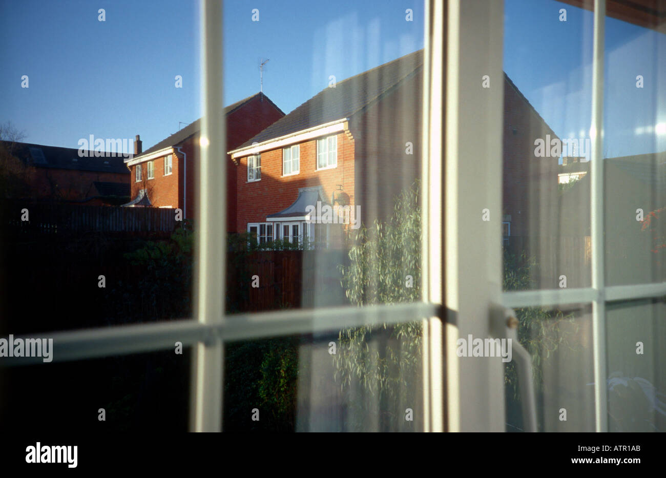 peering through window at the neighbours Stock Photo - Alamy