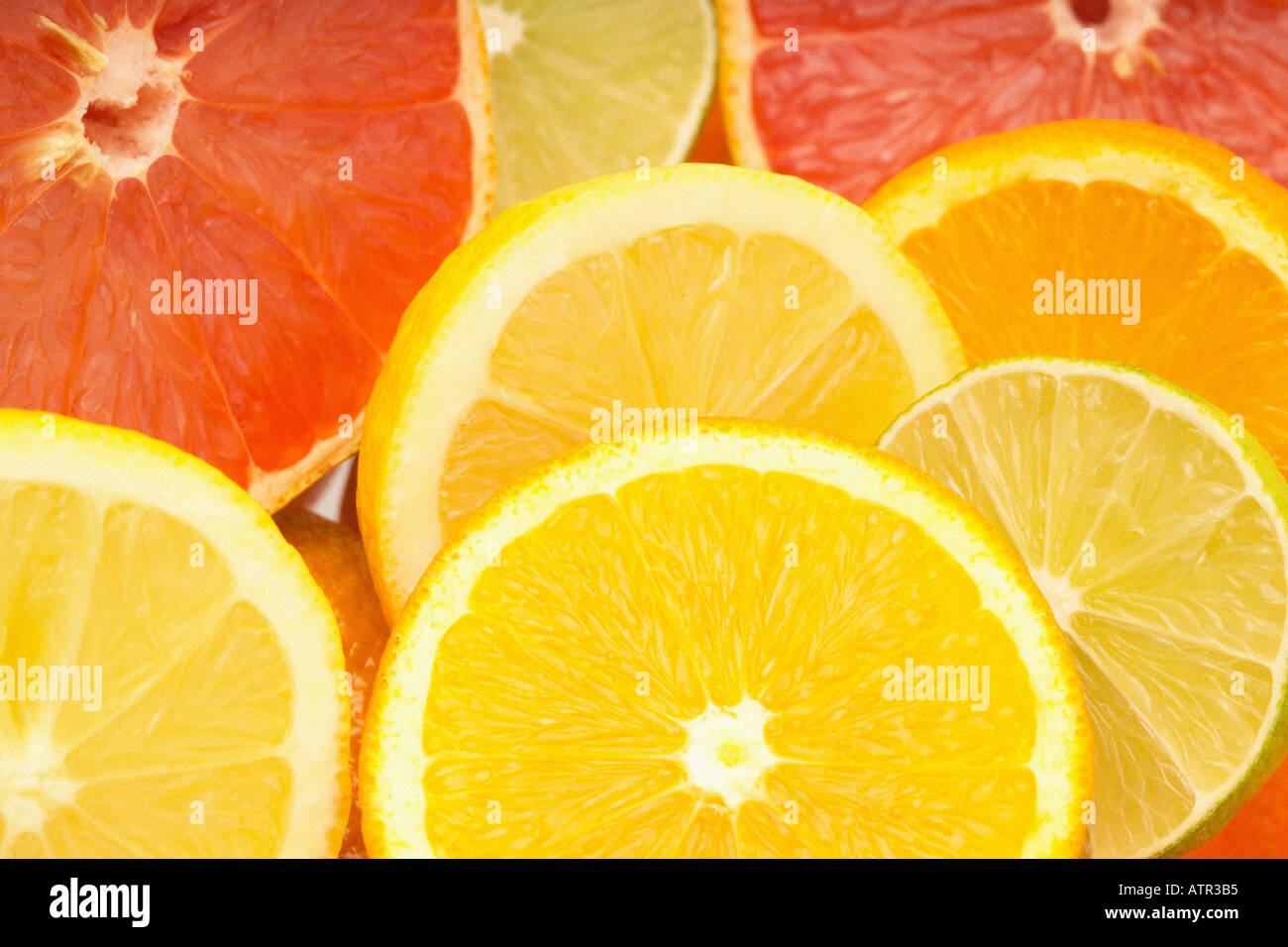 Citrus fruits sliced in half Stock Photo - Alamy