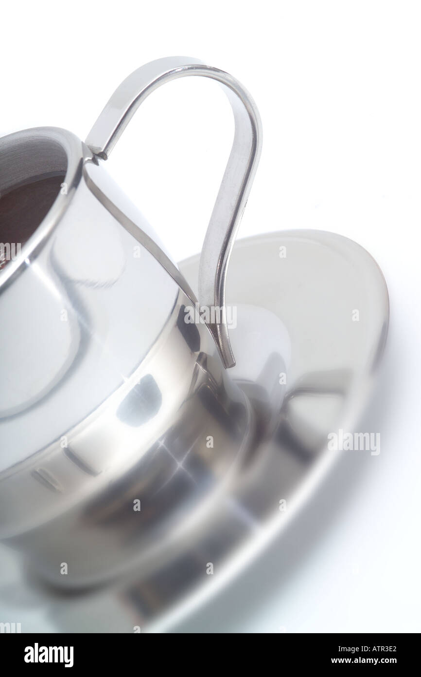 Metal coffee cup against white background Stock Photo - Alamy