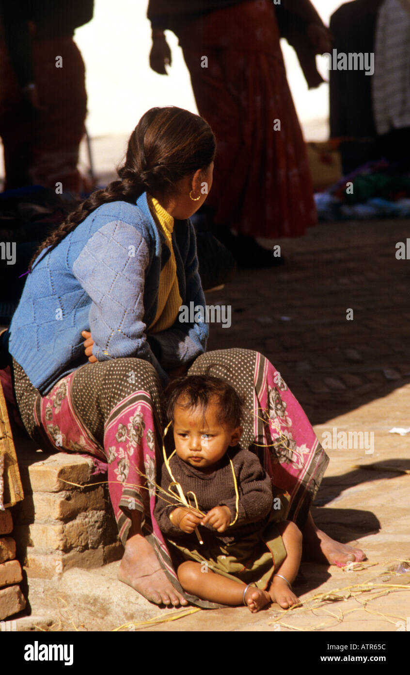 Mother and child sitting at Bodnath Temple Kathmandu NEPAL Stock Photo - Alamy