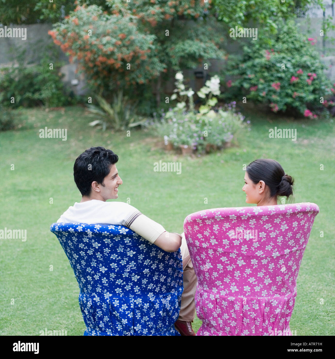 Couple sitting on chairs looking at a view hi-res stock photography and ...