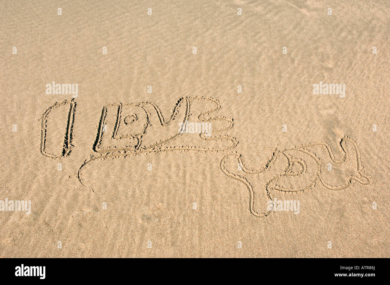 Writing in sand Stock Photo - Alamy