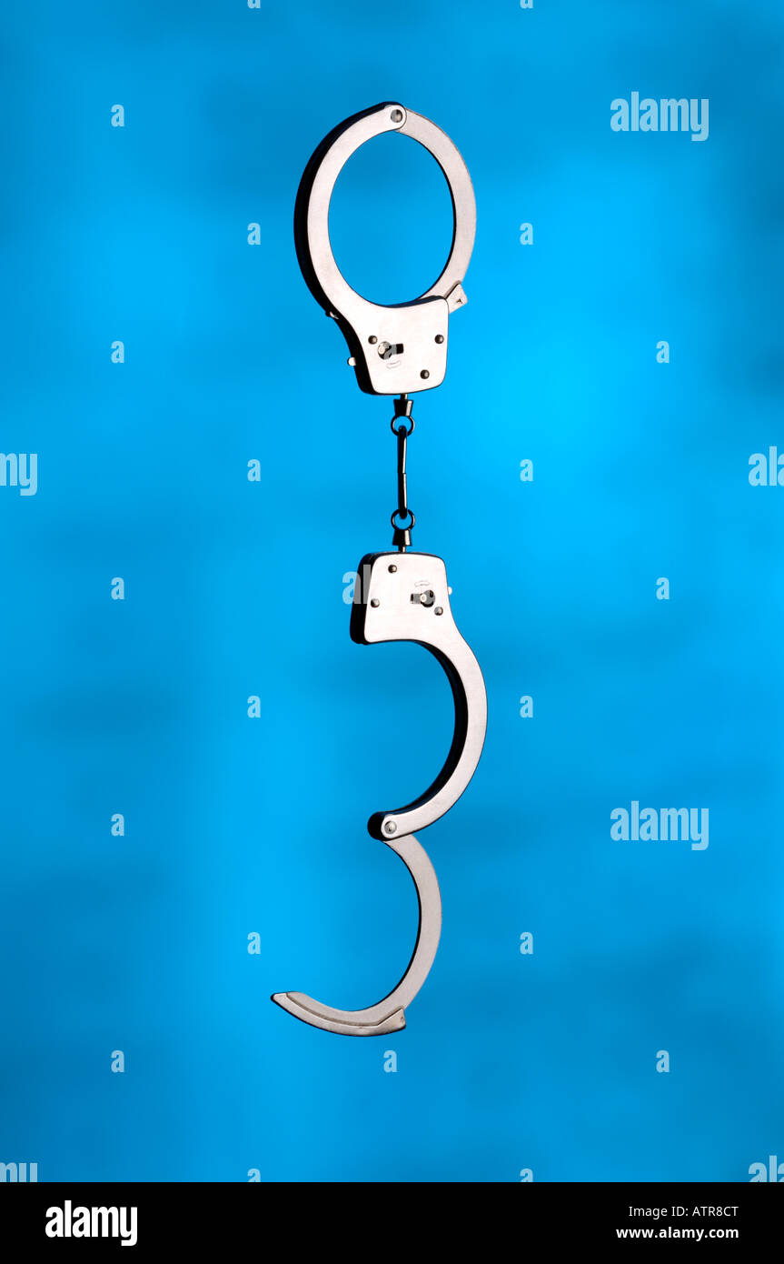 Hand cuff and hand hi-res stock photography and images - Alamy