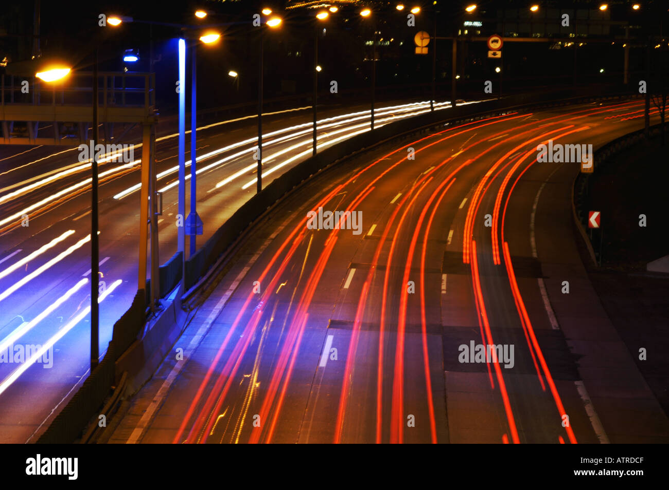 traffic at city highway at evening, light effects Stock Photo - Alamy