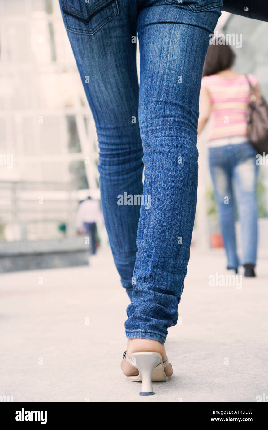 Low section view of a woman walking Stock Photo - Alamy