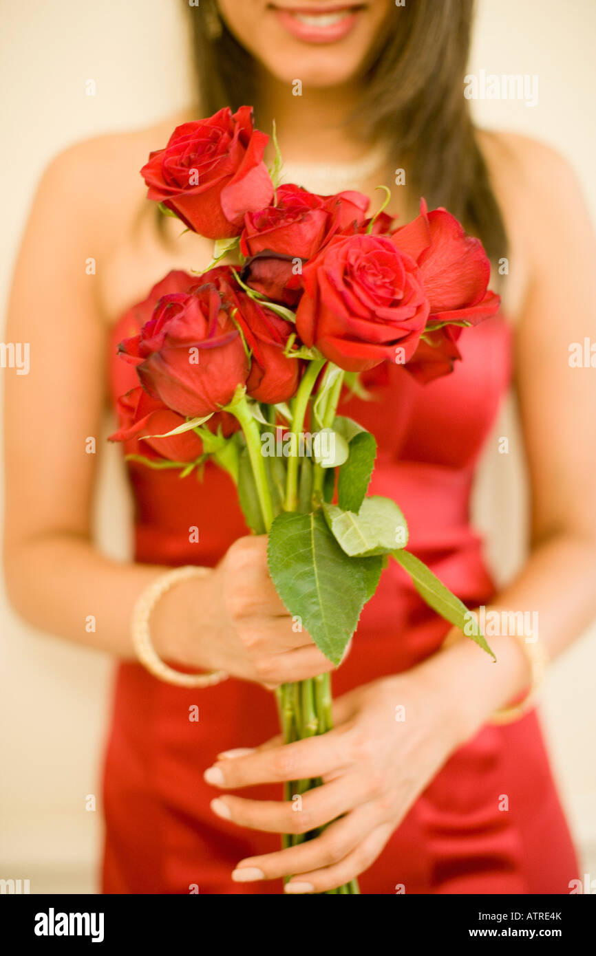 Indian young woman red roses hi-res stock photography and images - Alamy