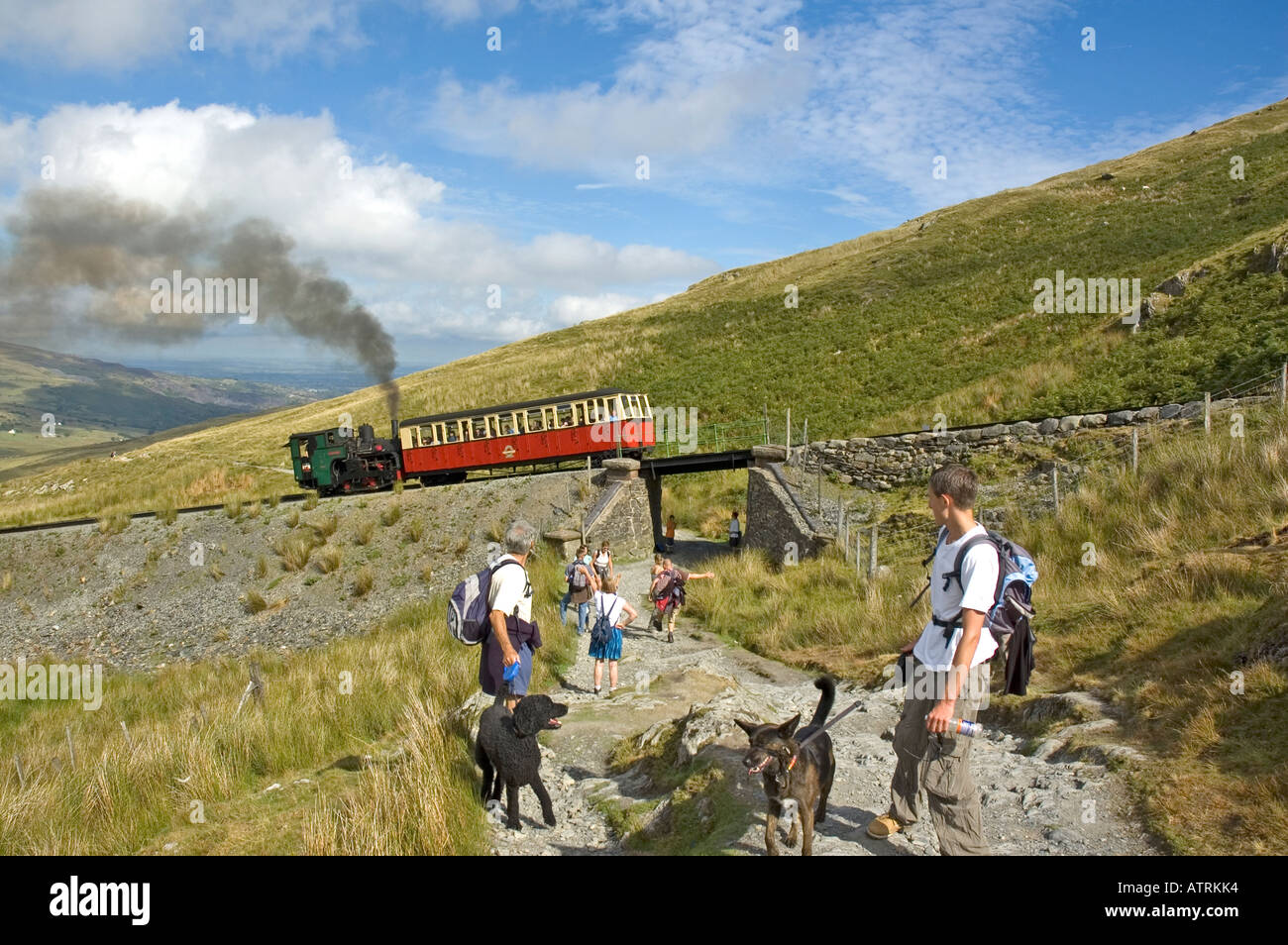 Steam locomotive Snowdon Mountain Railway and walkers Stock Photo - Alamy
