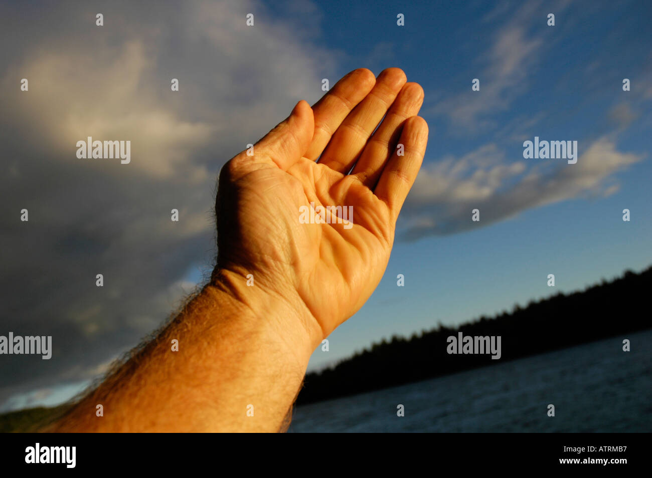 Stretched his hand to the sky hi-res stock photography and images - Alamy