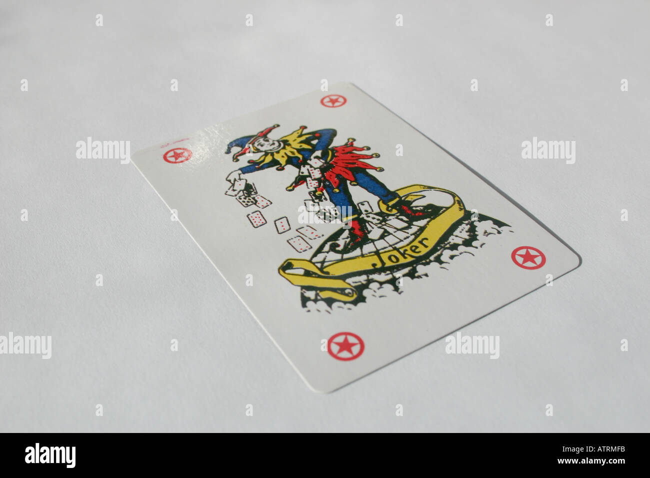 Joker or jester playing card from deck of cards on plain Stock Photo ...