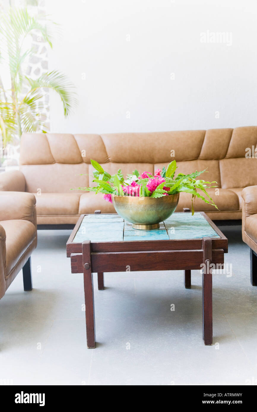 Bowl of flowers on a table in a living room Stock Photo - Alamy