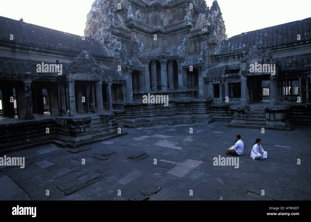 Angkor two people meditating in the Angkor Wat temple Stock Photo - Alamy