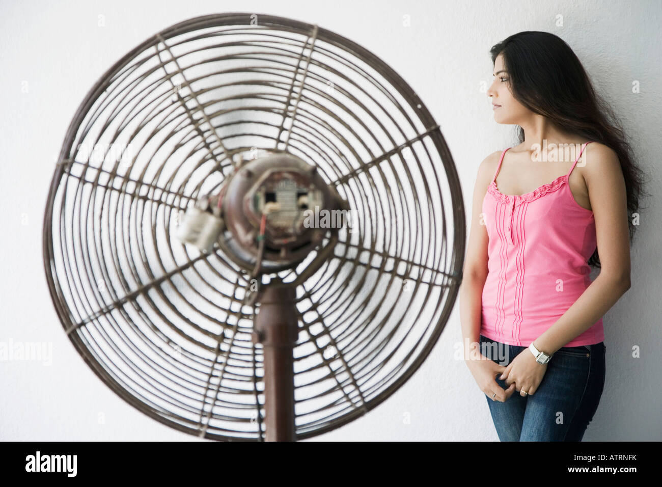 Woman standing with fan hi-res stock photography and images - Alamy