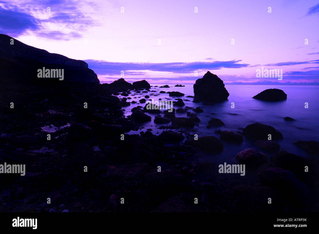 Llandudno rock formations in low-light Stock Photo - Alamy