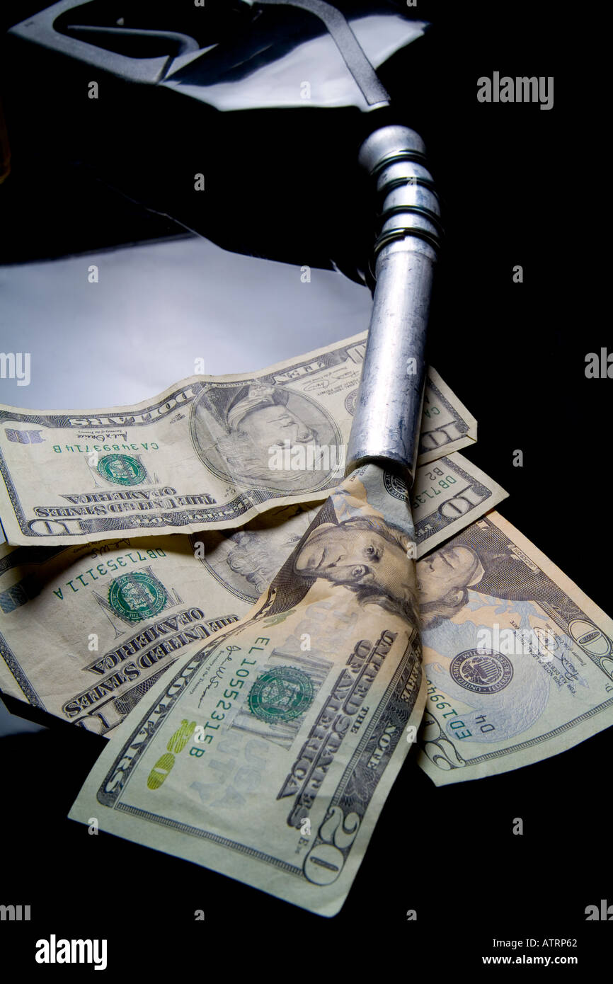 Cash flowing from gasoline pump nozzle Stock Photo - Alamy