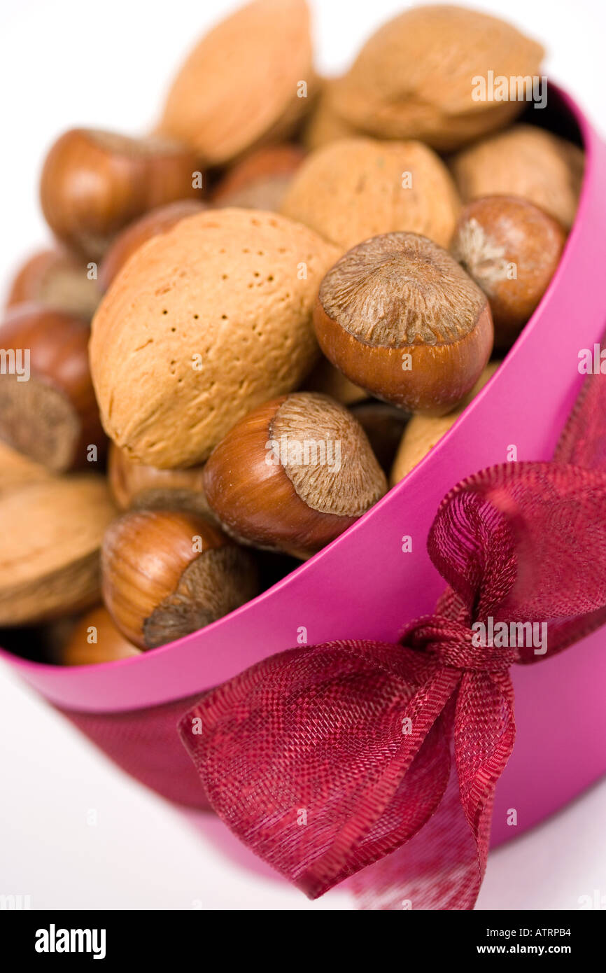 Selection of nuts packaged in decorative box Stock Photo - Alamy