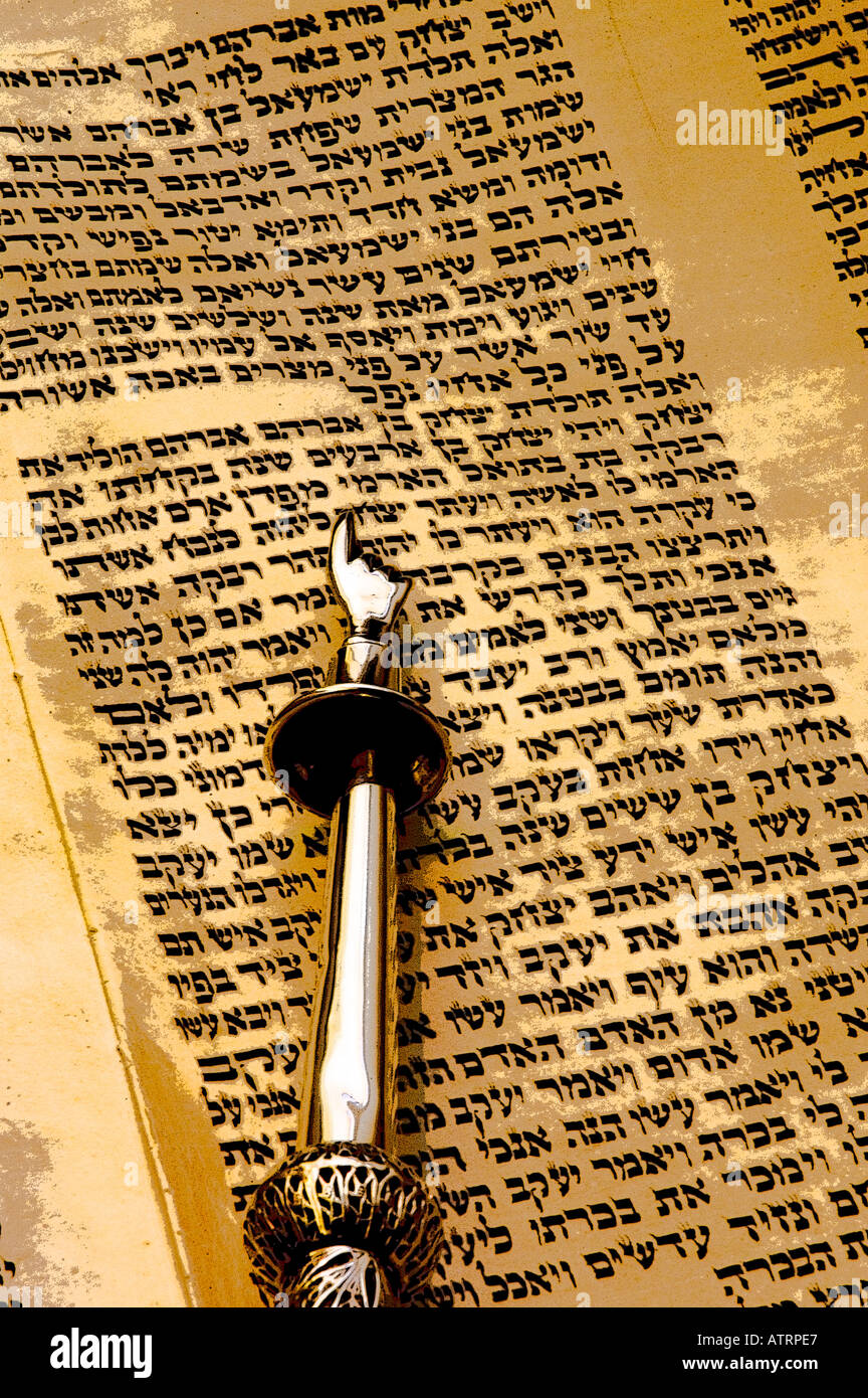 Silver pointer lying on Torah scroll Stock Photo - Alamy