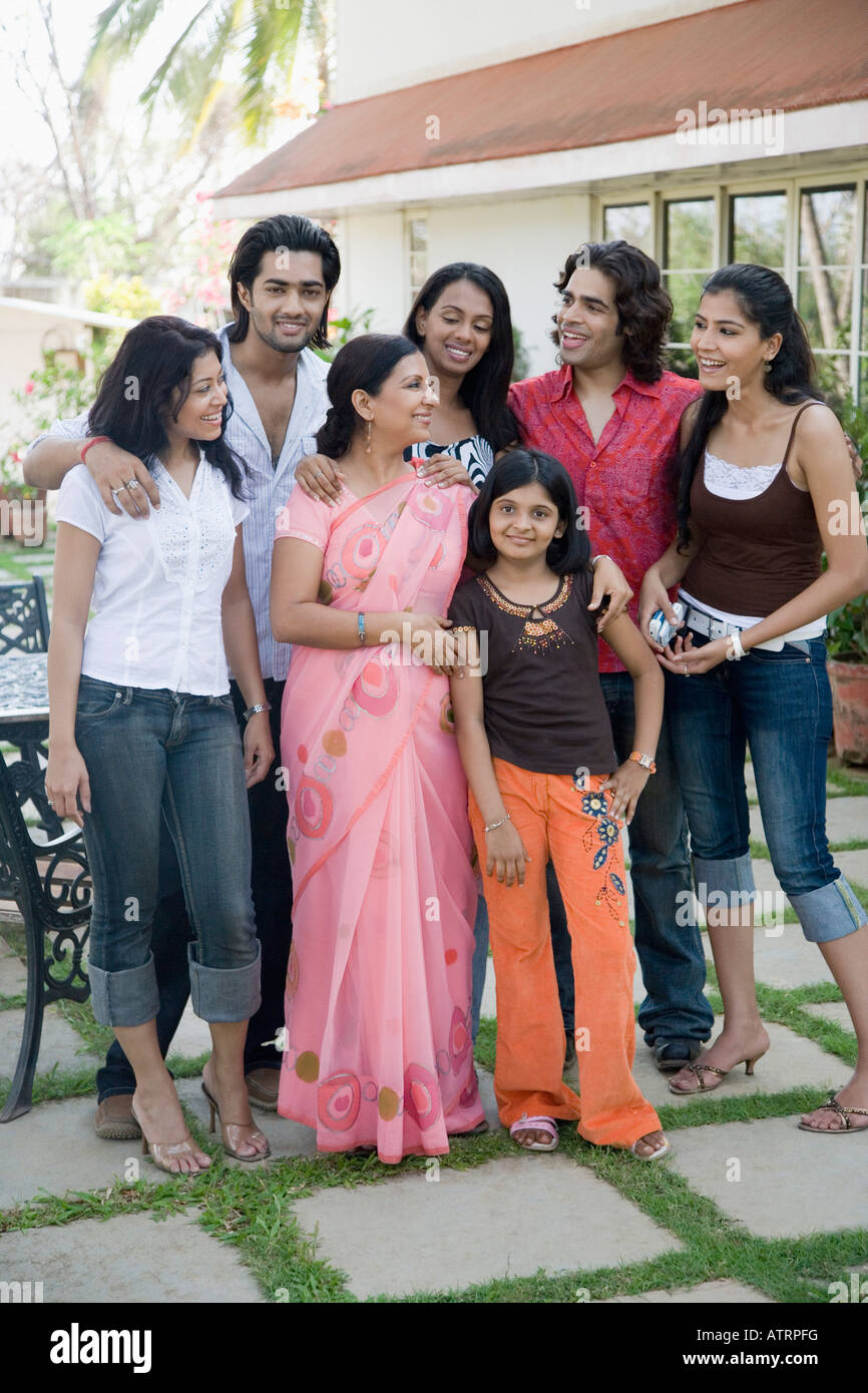 Group of people smiling and standing together Stock Photo - Alamy