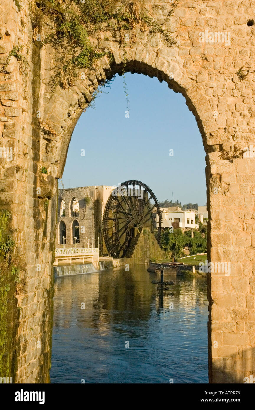 Giant wooden water wheel, Noria, early morning light and reflection, on ...