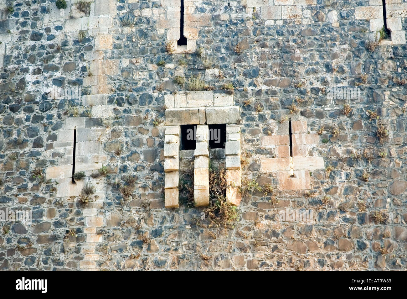 Massive towering walls embrasures and ramparts in the early morning ...