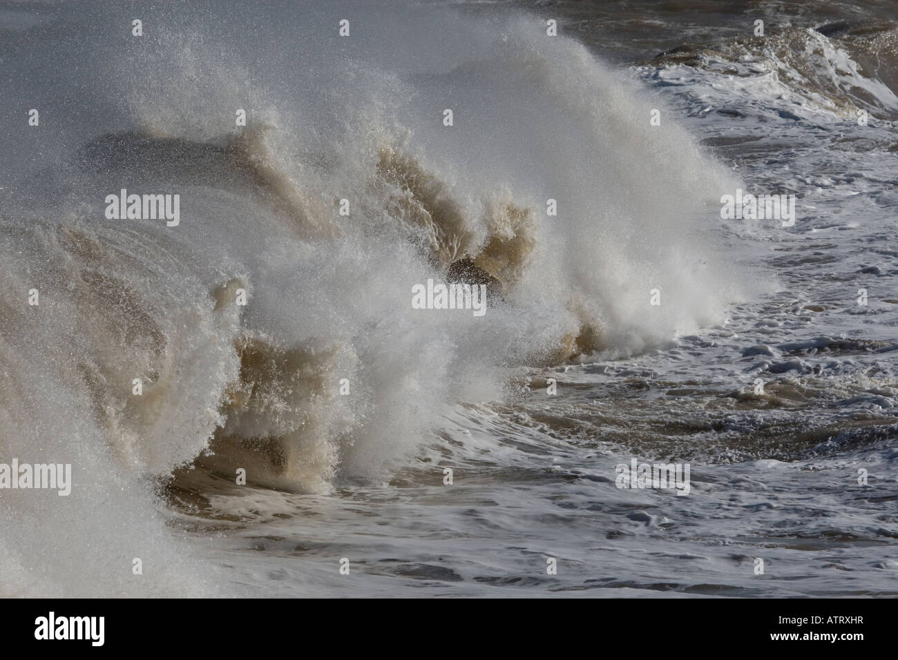 Waves at high tide North Norfolk Coast UK Stock Photo - Alamy
