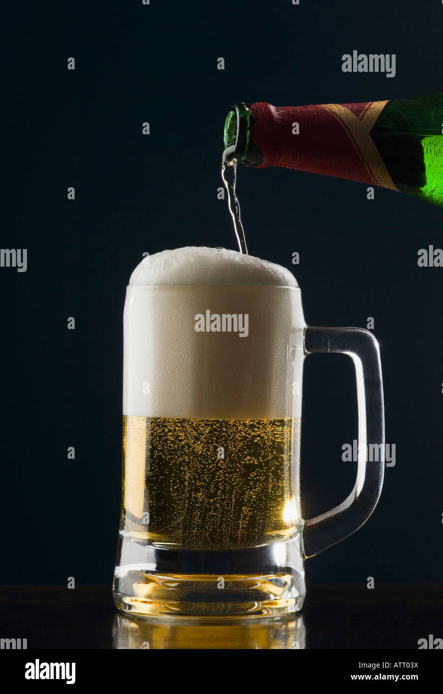 Close-up of beer being poured into a beer glass Stock Photo - Alamy