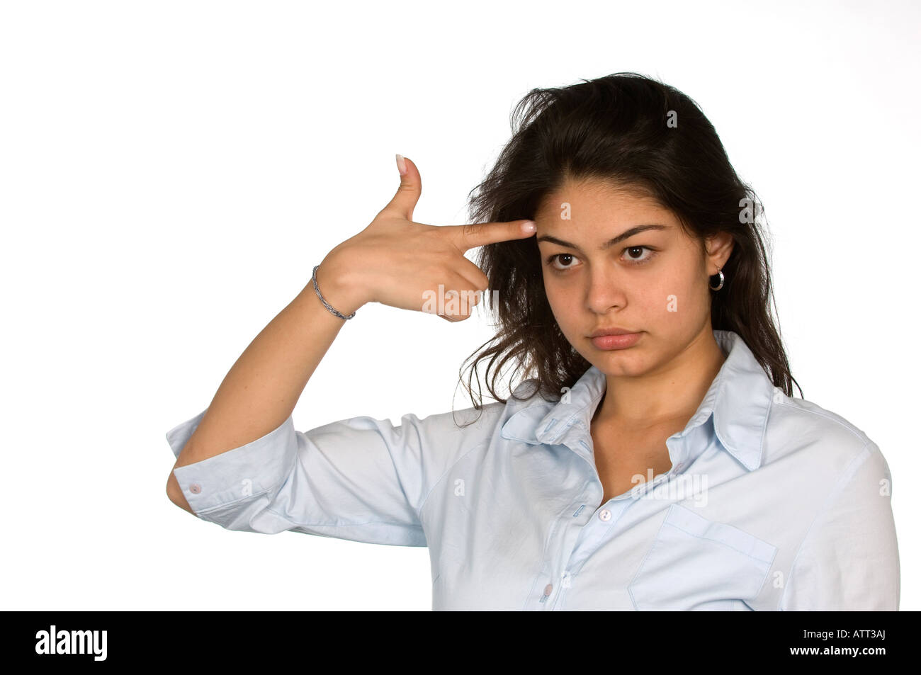 Sad female teen making a gun sign next to her head Stock Photo - Alamy