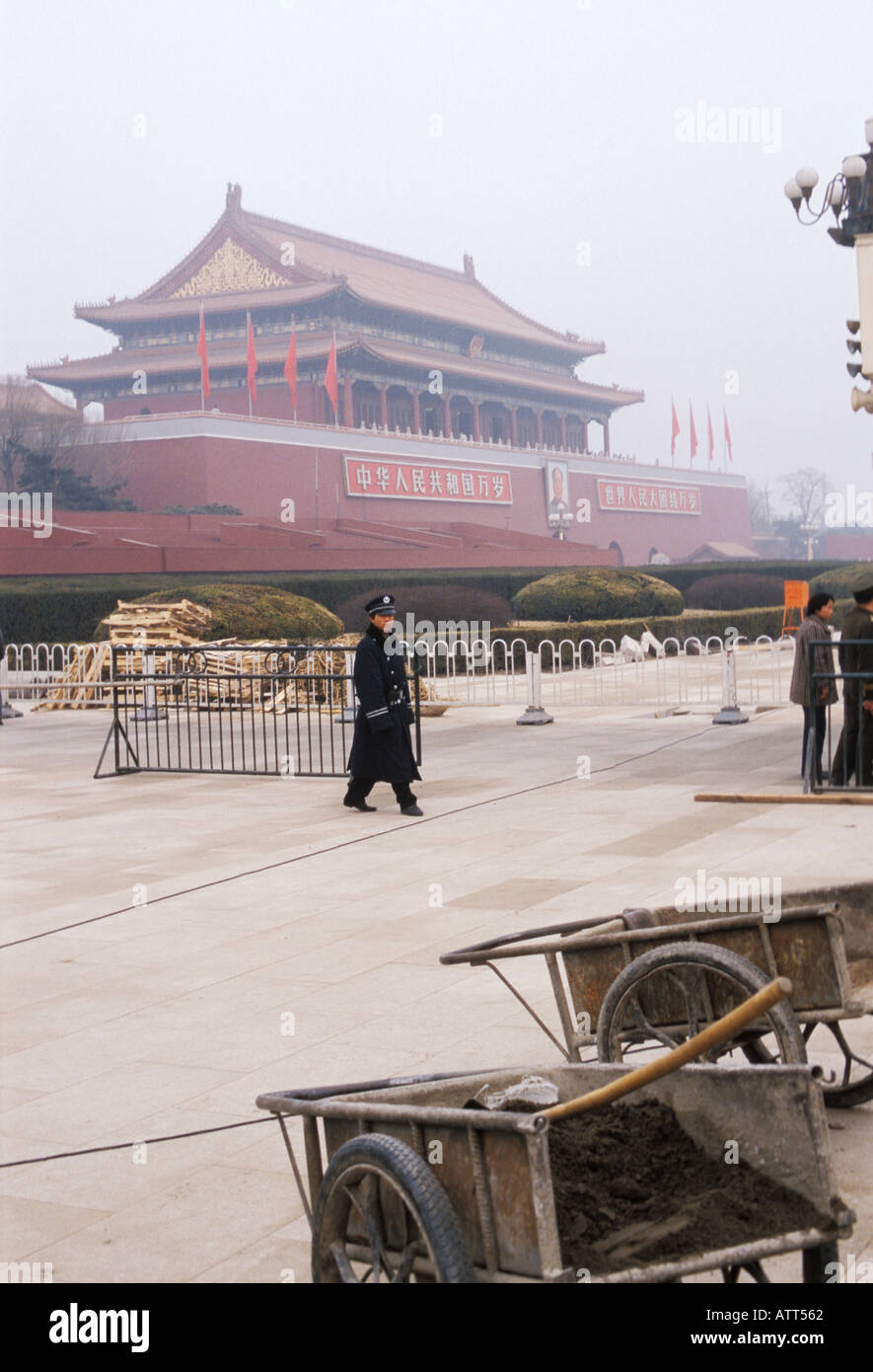 Soldier guarding inner plaza of Tiananmen Square Mao portait behind ...