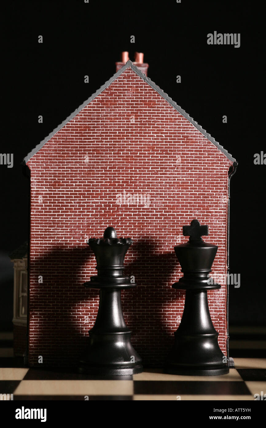 Model terraced house with chess pieces Stock Photo - Alamy