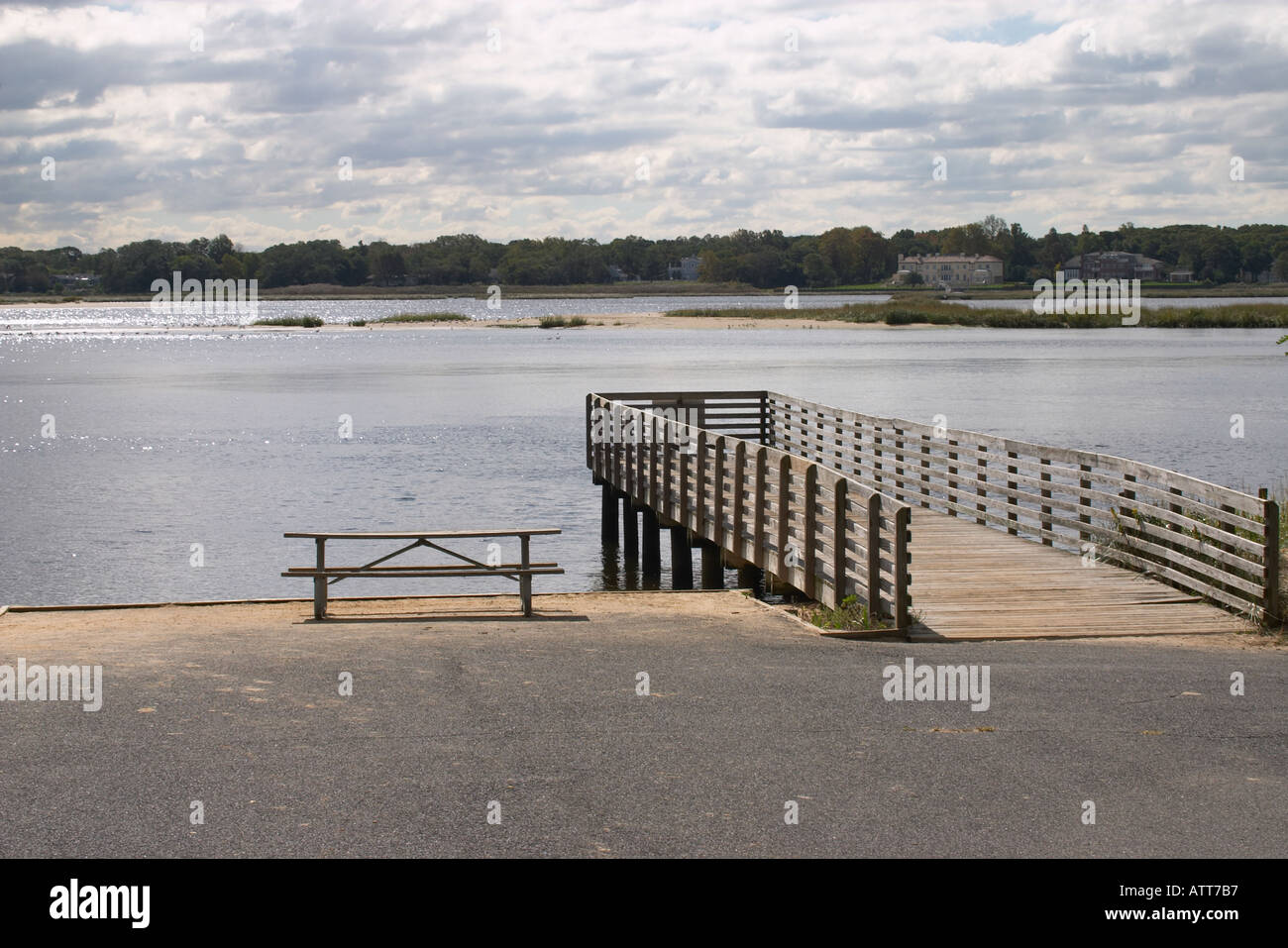 Deck and table along a river Stock Photo - Alamy