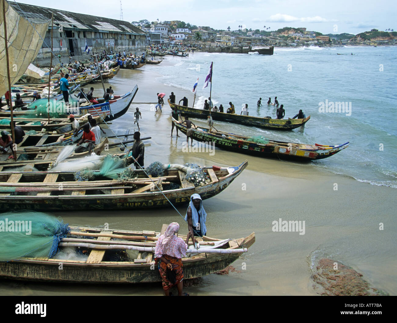 Fishing boats and fishermen, Cape Coast, Ghana Stock Photo - Alamy