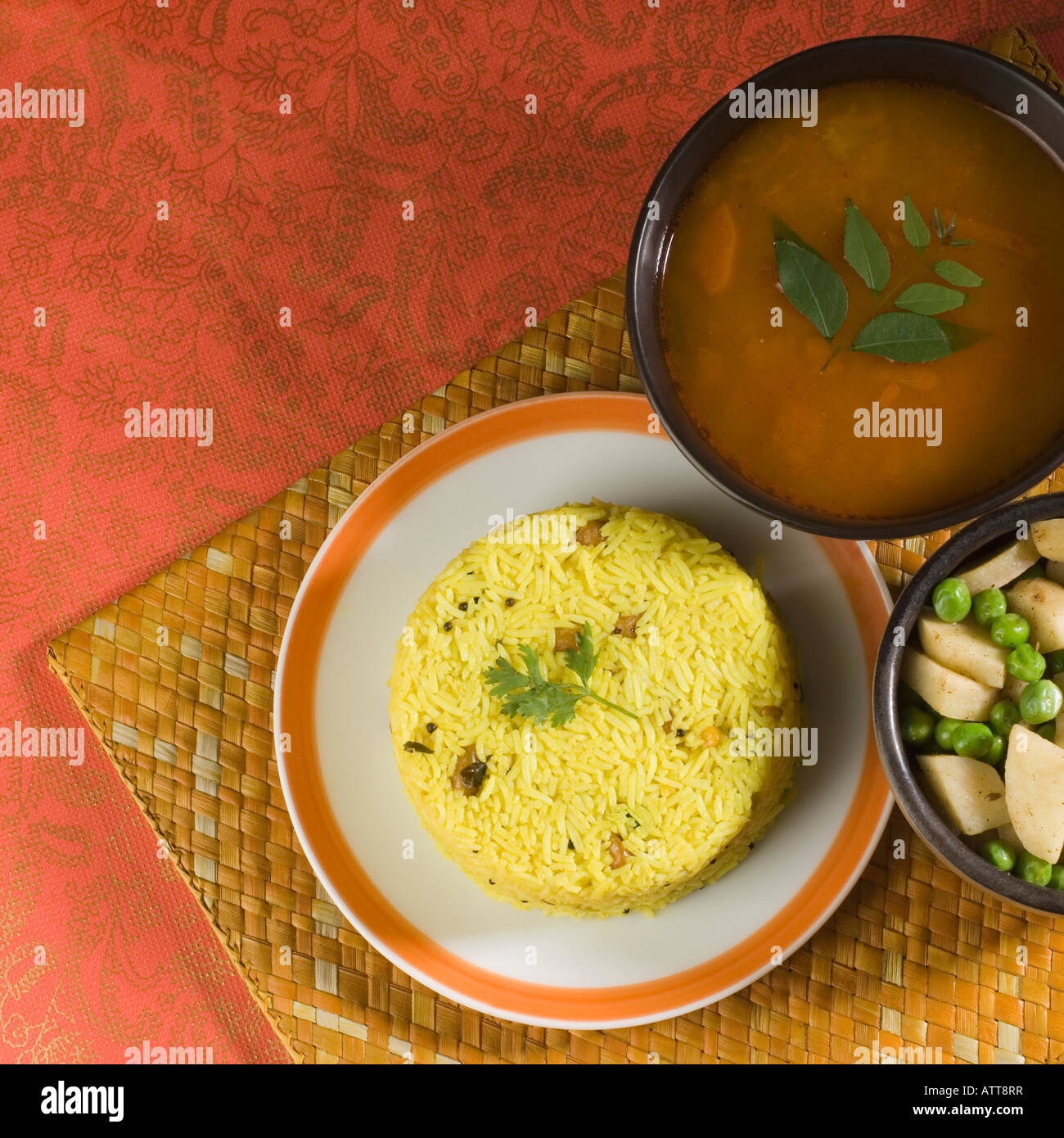 High angle view of rice in a plate with daal and fried peas and potato ...