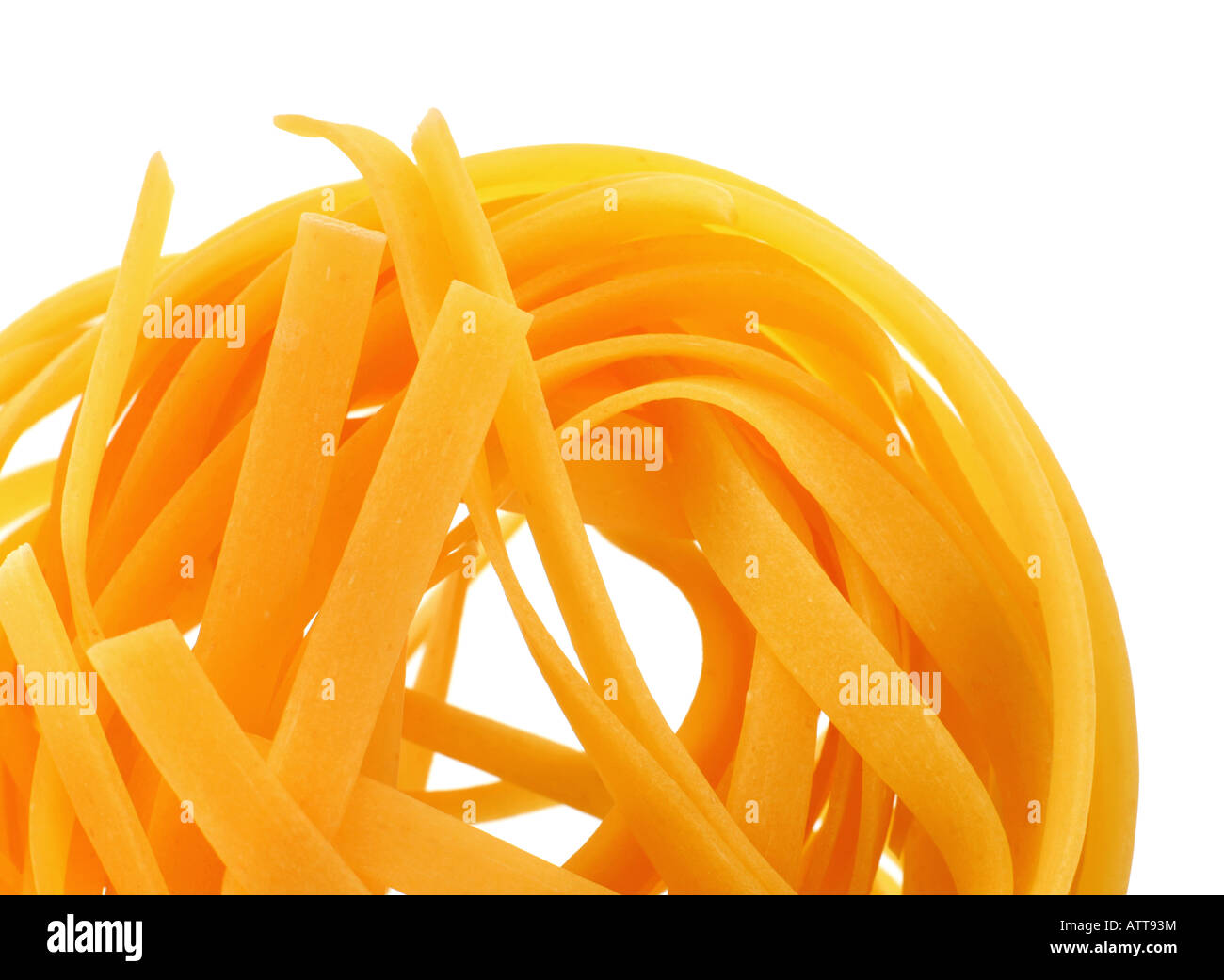 Yellow pasta detail isolated on white background Stock Photo - Alamy