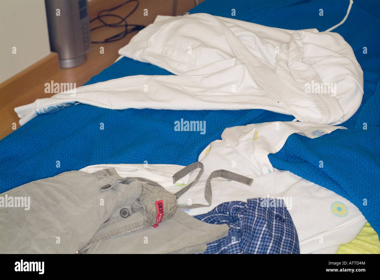 clothes on top of the bed Stock Photo - Alamy