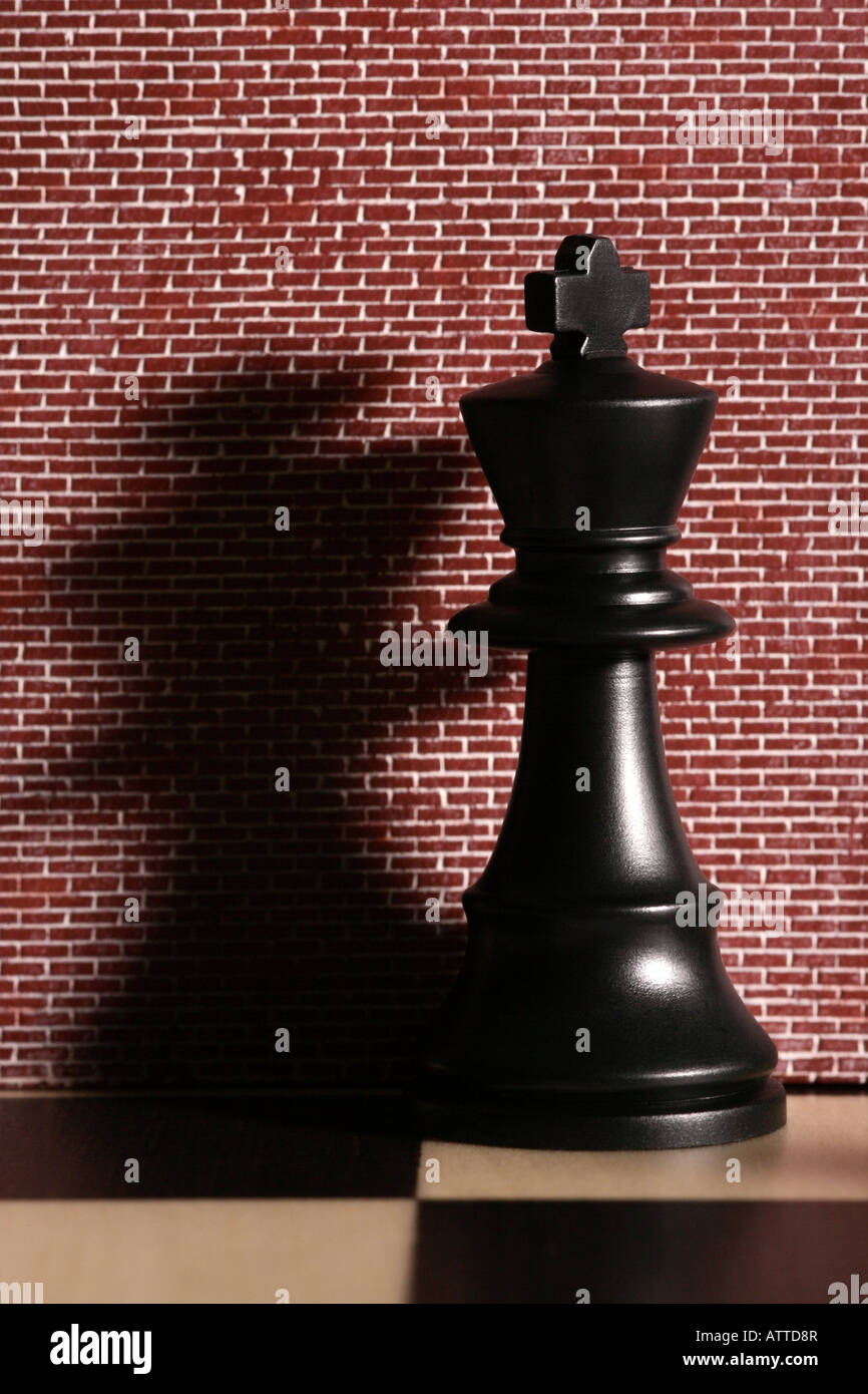 Chess pieces with model houses in the background Stock Photo - Alamy