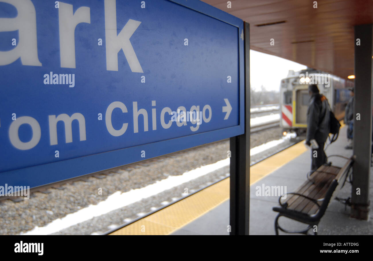 Sign on a train platform directing commuters to trains toward Chicago ...