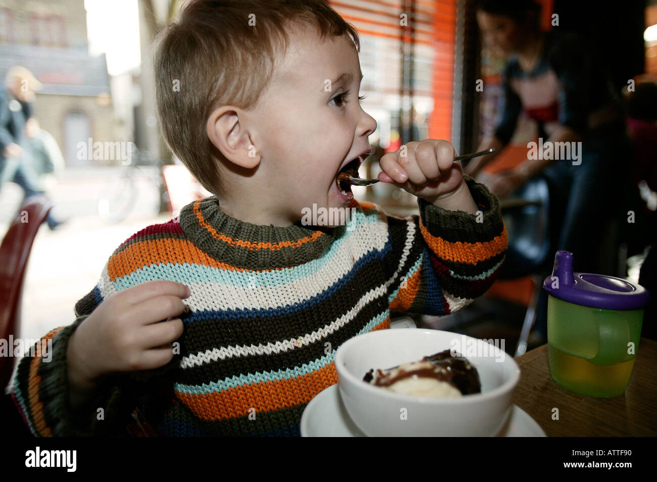 boy in restaurant eating Stock Photo - Alamy