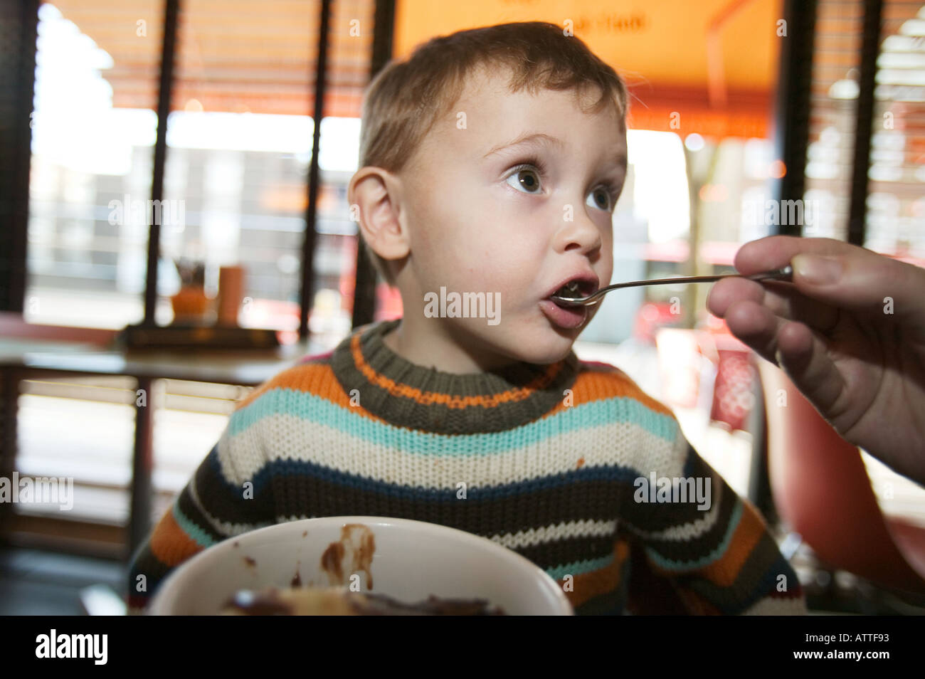 boy in restaurant eating Stock Photo - Alamy