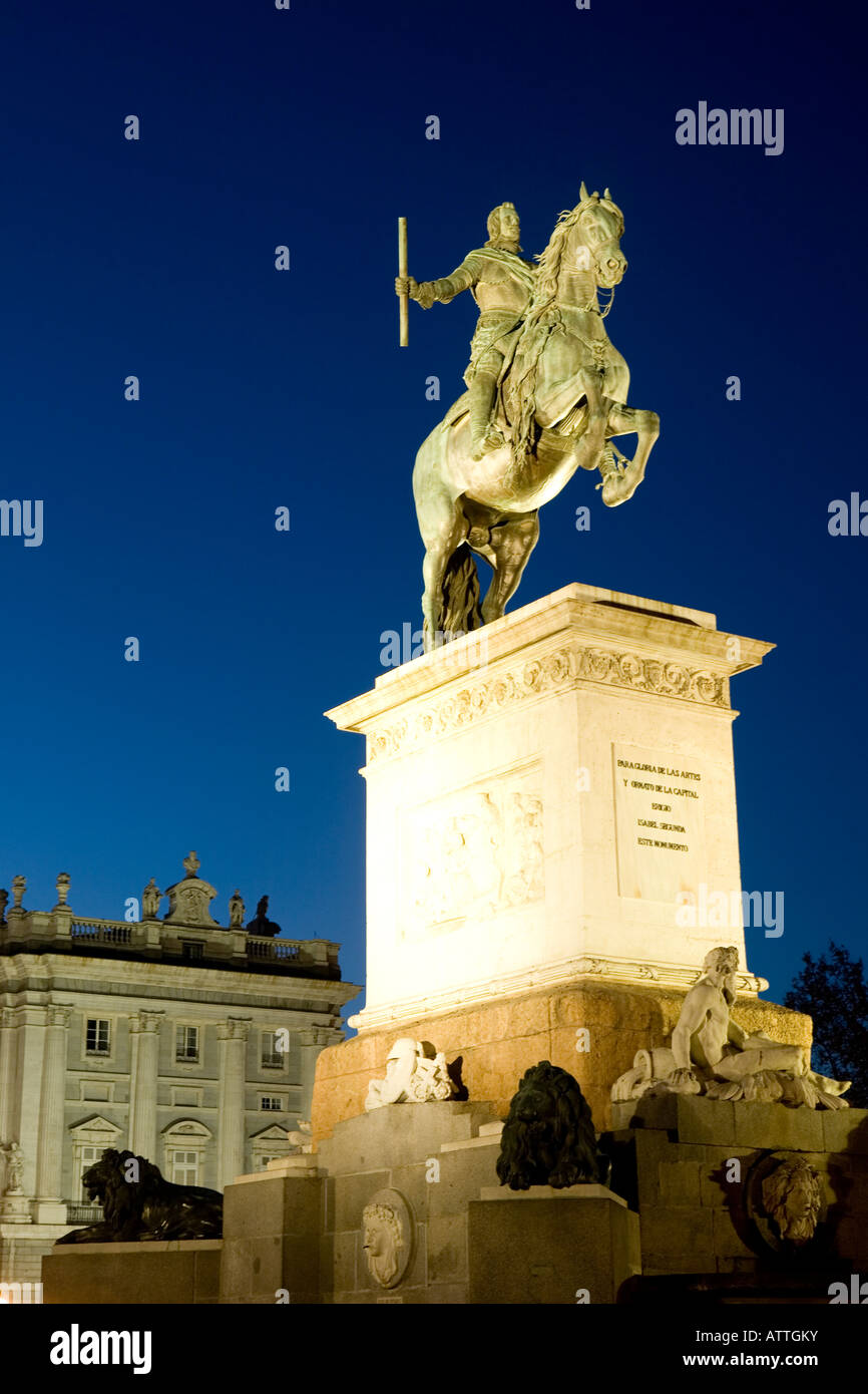 Palacio Real and Statue Felipe IV at Plaza de Oriente in Madrid at dusk ...