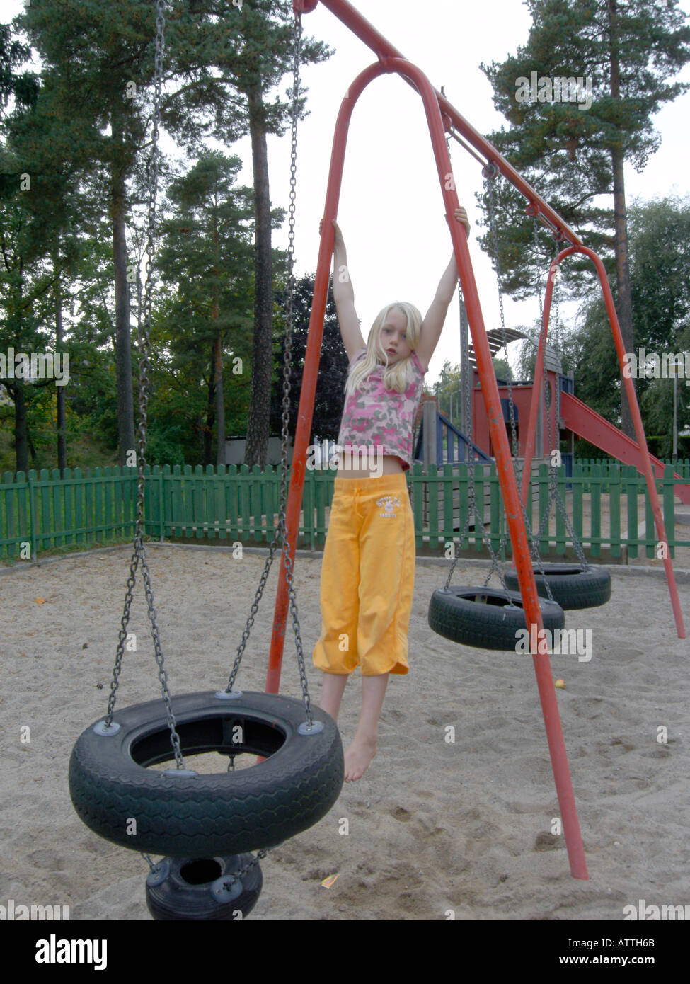 Girl in swing Stock Photo - Alamy