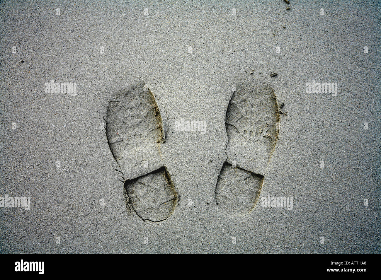 Footprints of boots in sand Stock Photo - Alamy