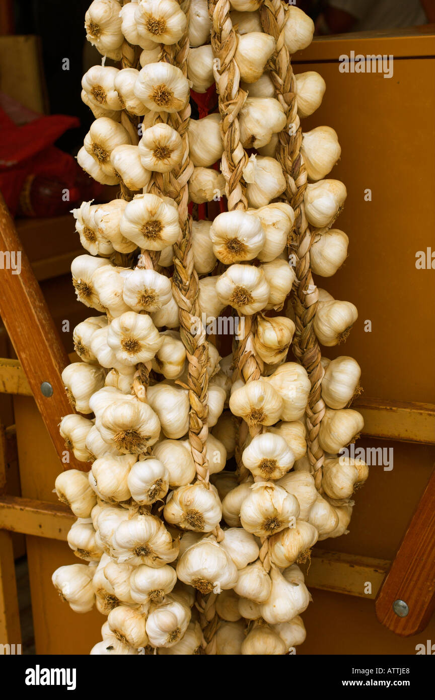 Hanging strings of garlic at market stall in old town section of Zadar ...
